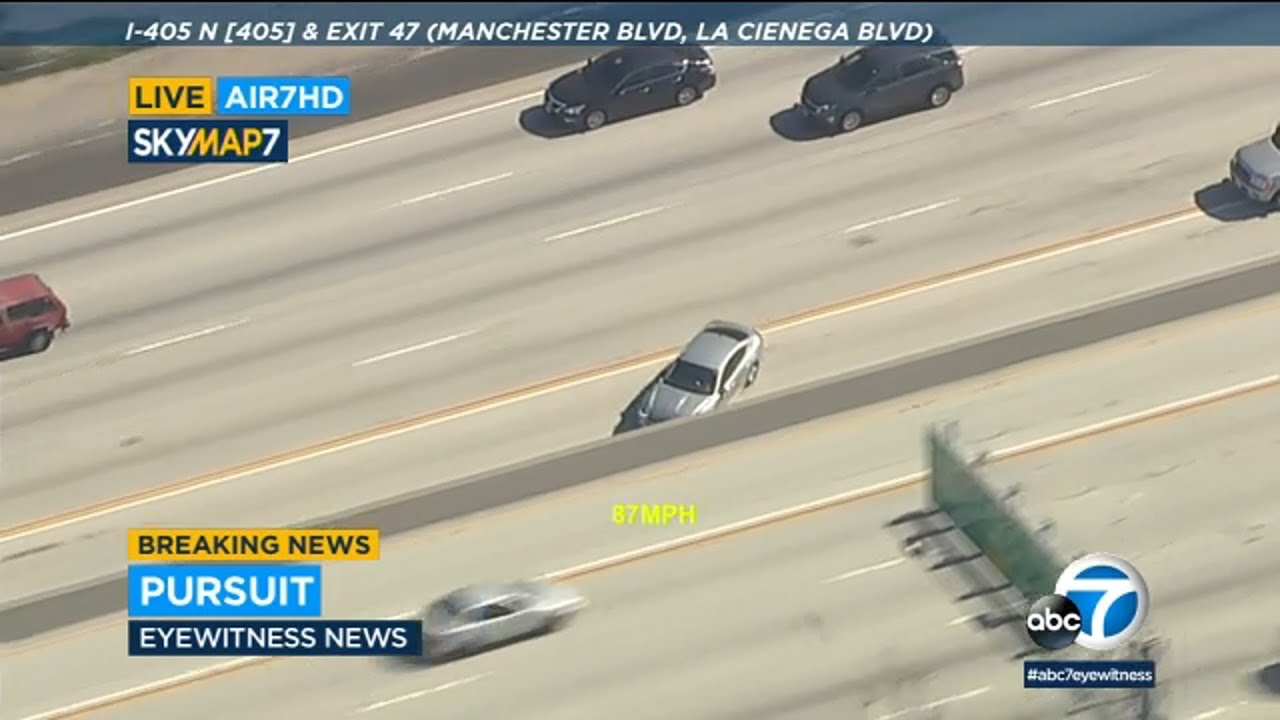 Possible murder suspect crashes into freeway center divider during wild ...