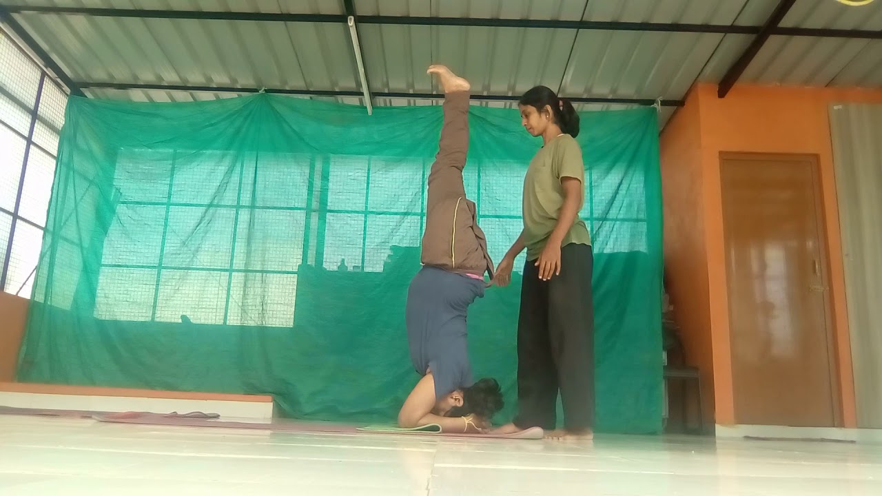 Headstand by one legged lady Nagaveni - YouTube