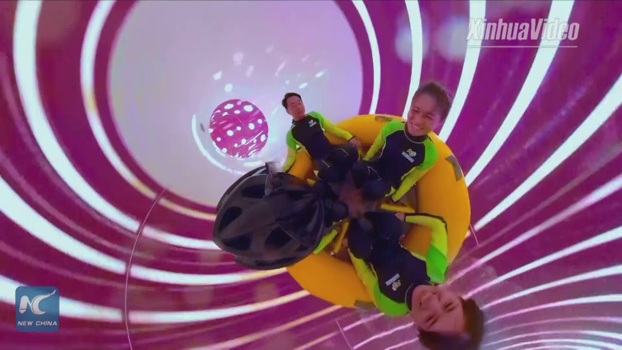 World's first rotating water slide to open in south China - YouTube