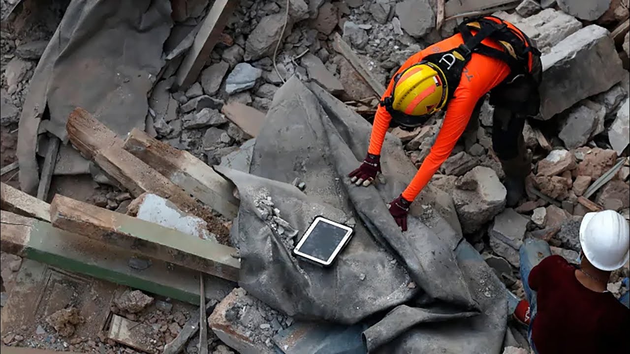 Rescue teams detect what could be a survivor trapped under rubble in ...