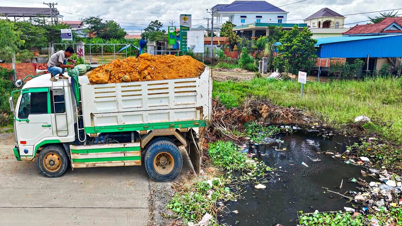 First Start New Project Landfill Flooded area !! Dump Truck Unloading ...