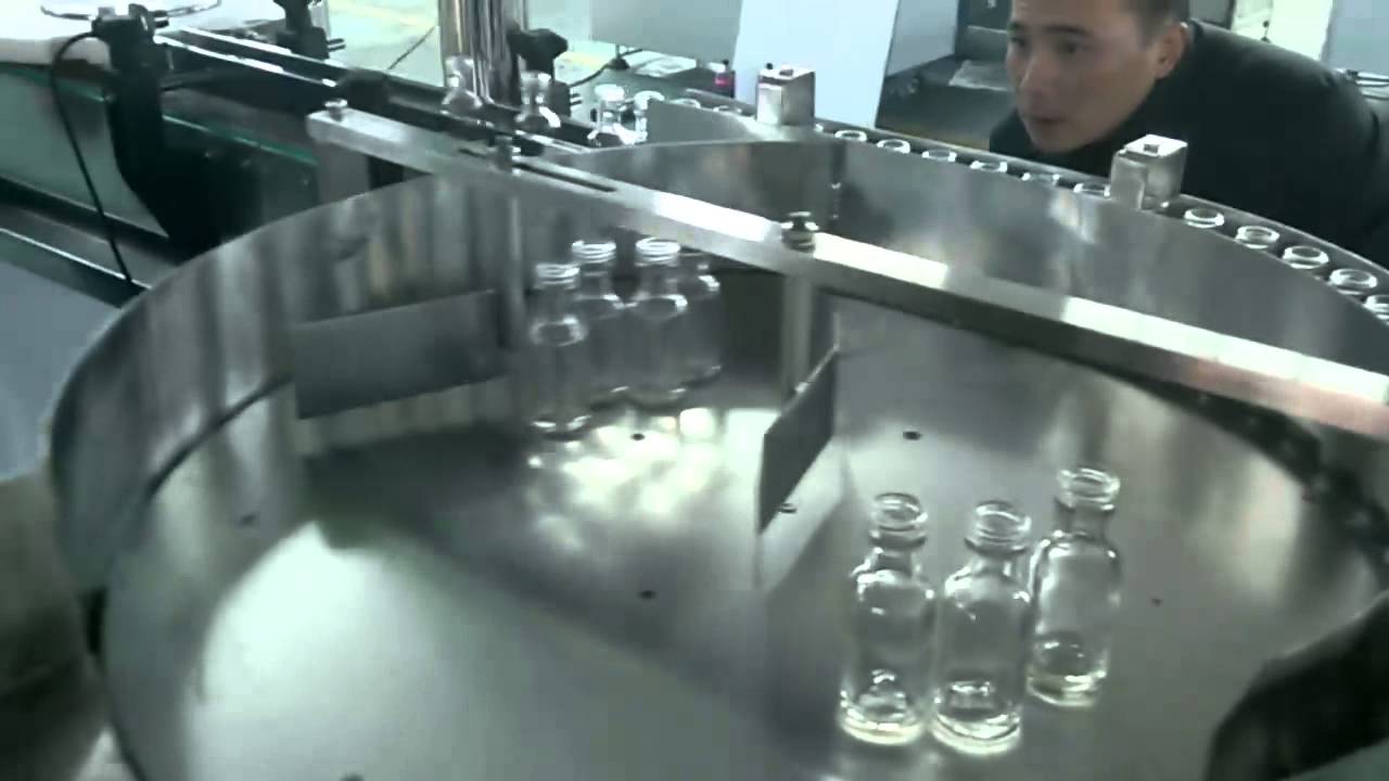 glass bottle unscrambler and aluminum cap sealing machine - YouTube