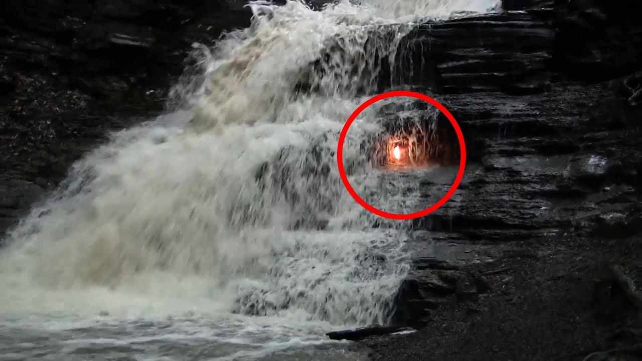 Amazing ! This waterfall has an eternal fire that resembles the devil's ...