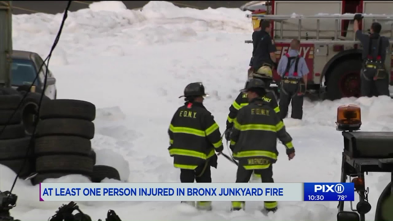 At least one person seriously injured in Bronx junkyard fire - YouTube
