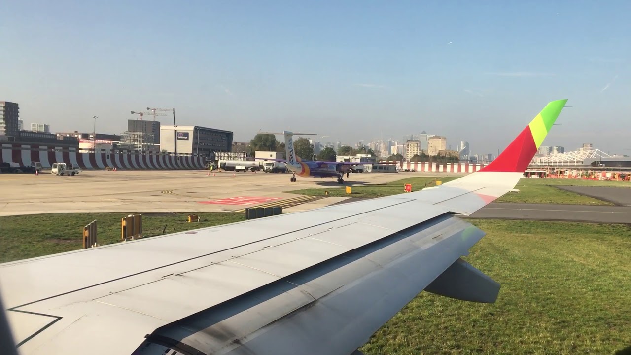TAP Portugal Embraer E90 landing at London City Airport - YouTube