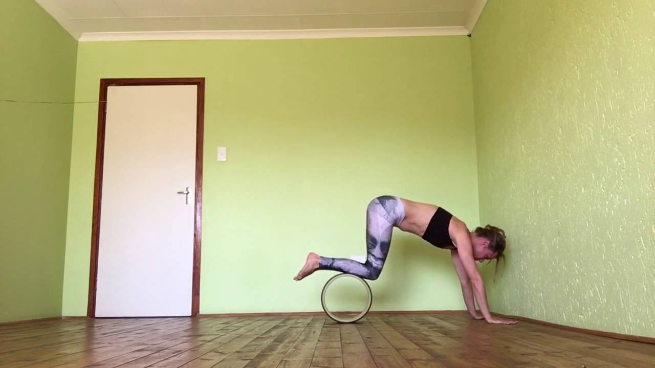 Handstand press practice with yoga wheel - YouTube