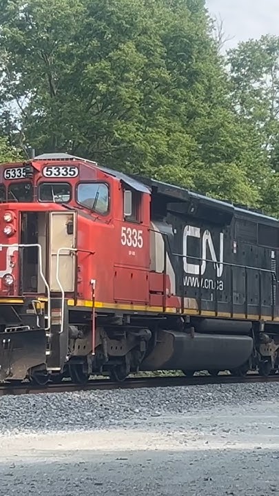 CN 5335 leading IC 1036 on a stopped tanker train! - YouTube