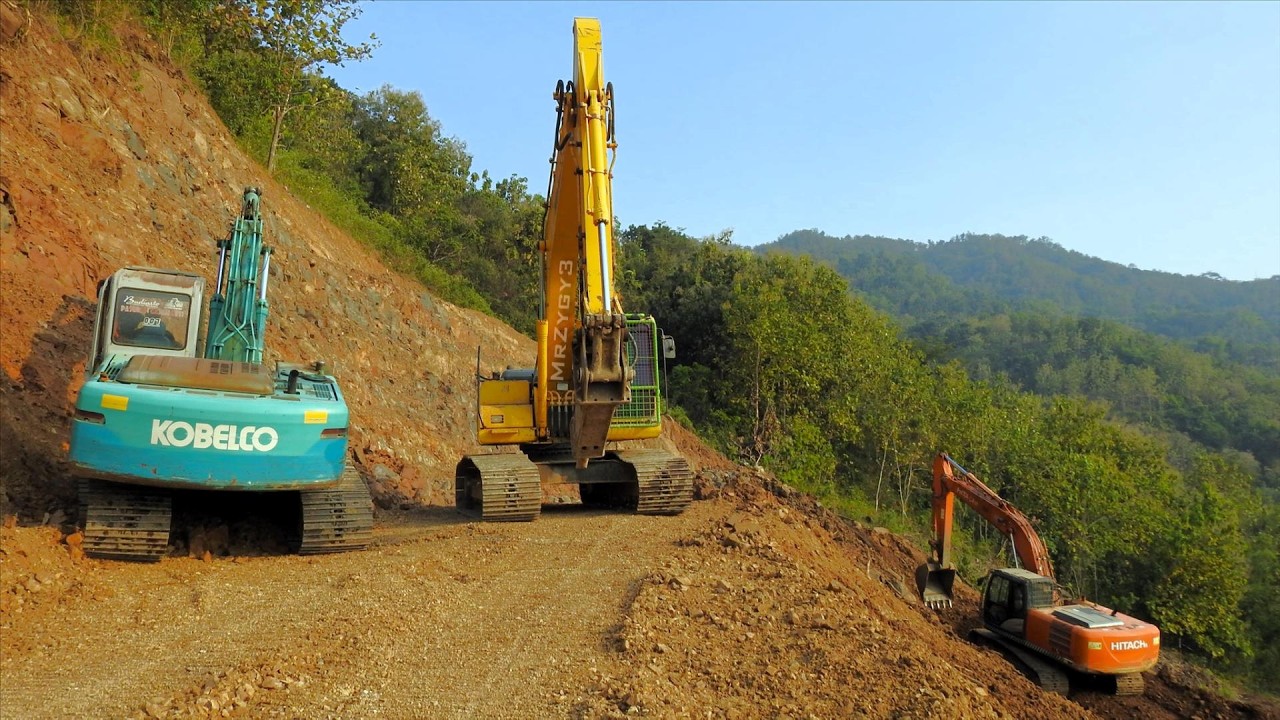 Construction Process To Build A New Road On A Steep Mountain Slope ...