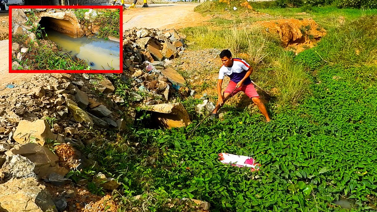 Unclogging Culvert Drain Water - Removing Plants And Stone Clogged ...