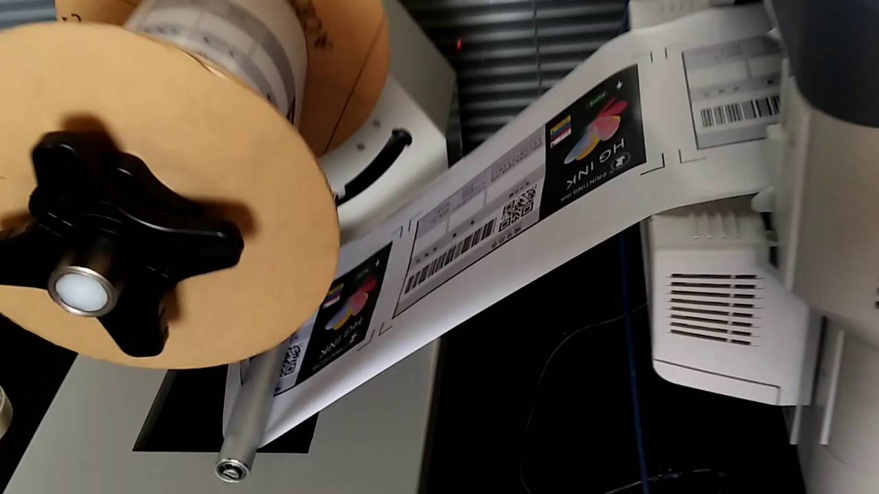 CMYK 4 colour laser label printer ---roll to roll - YouTube