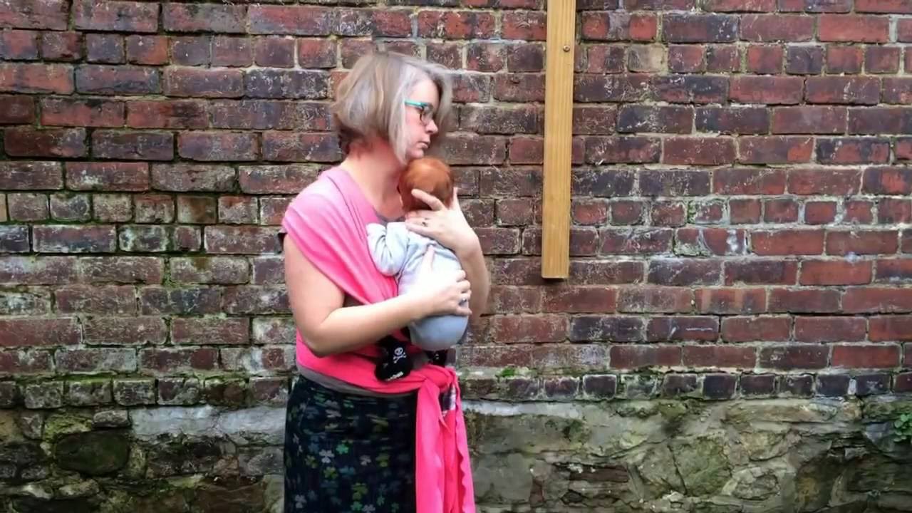 Unfurling a slumping baby in a carrier. Turn on captions for ...