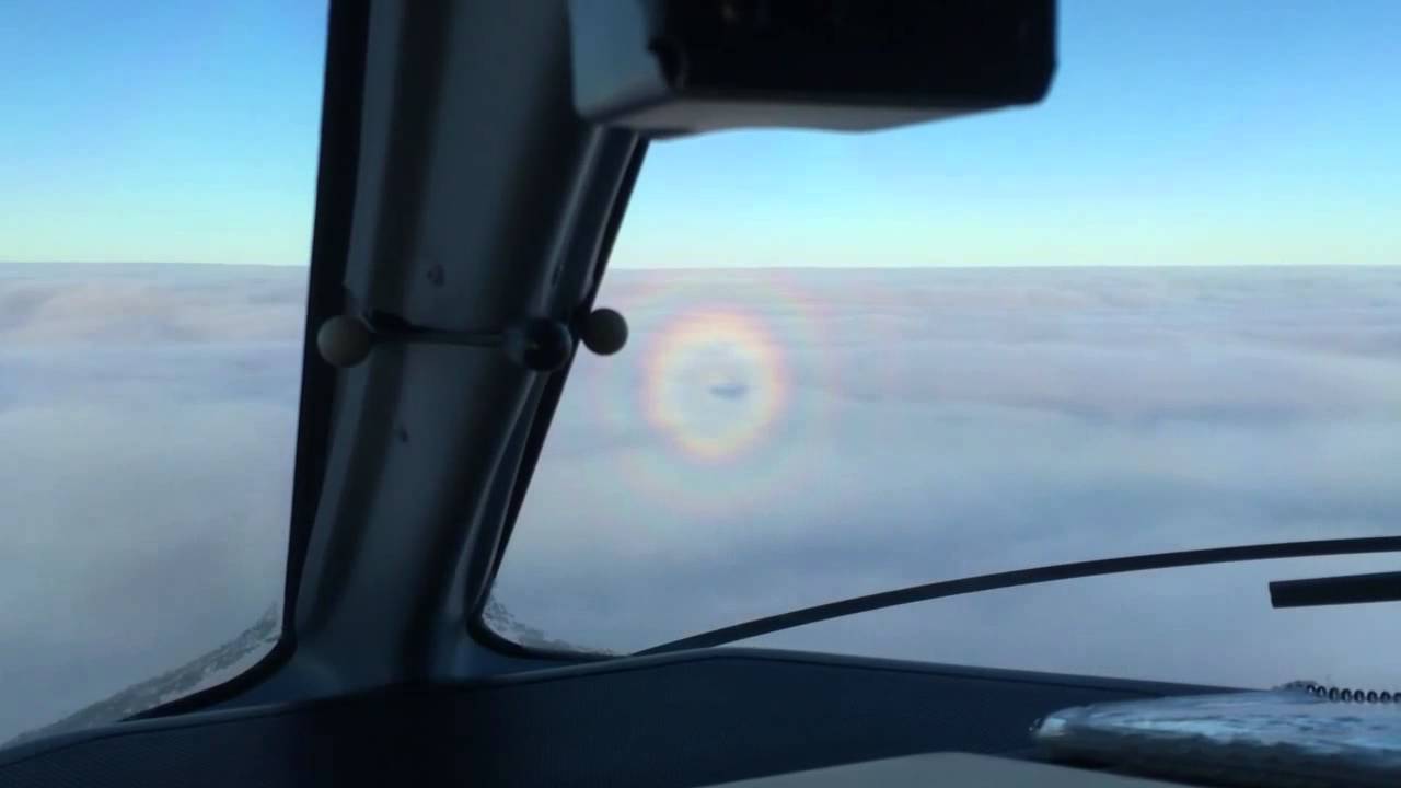 Airplane shadow when the sun has a halo - YouTube