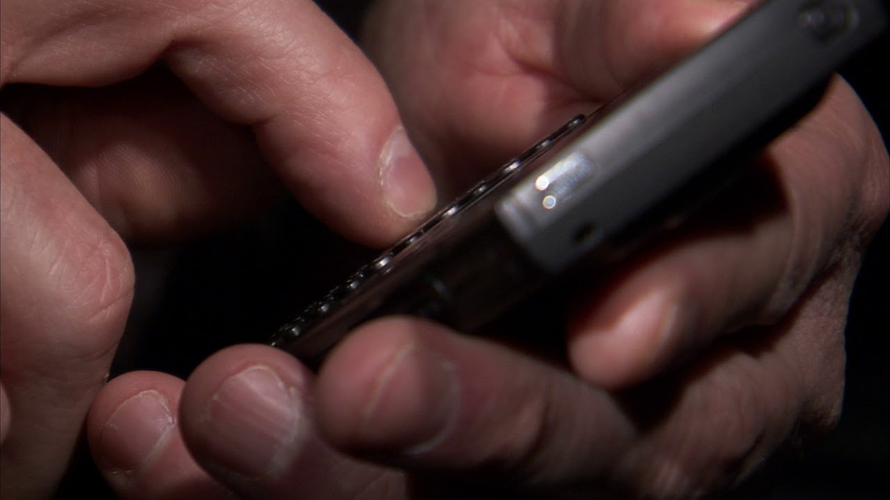 man pushing buttons on cell phone - YouTube