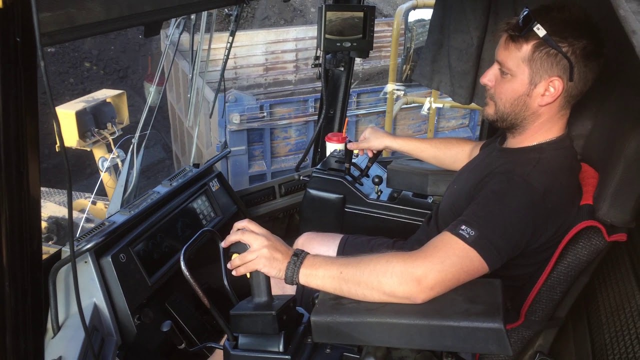 Caterpillar 990 Wheel Loader Loading Coal On Trucks - Operator View ...