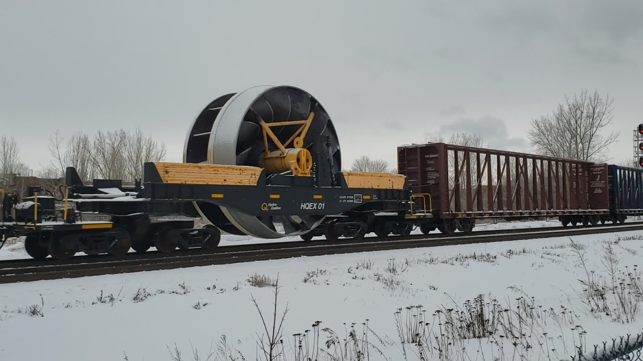 WINTER TRAINS CN Snowy Slow Freight With Odd Load at St Henri - YouTube