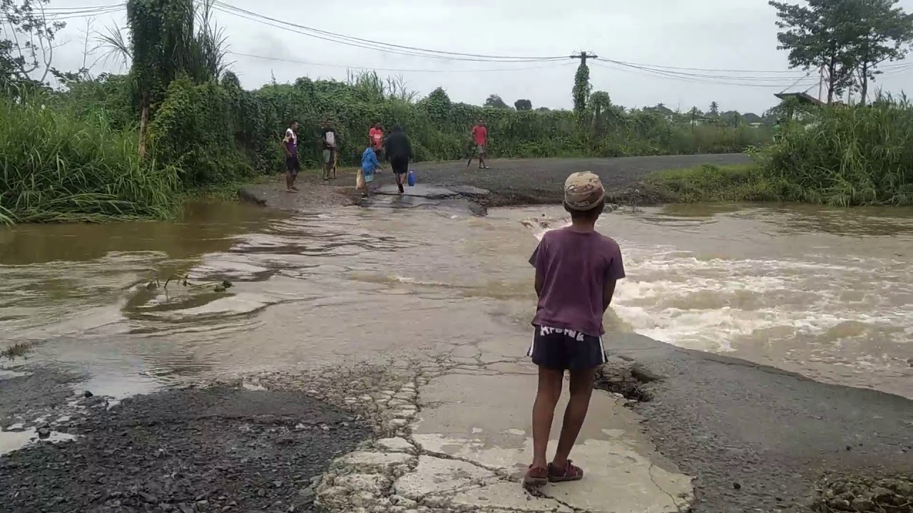 Villagers crossing the flooded Toga Bridge in Rewa this morning 22.04. ...