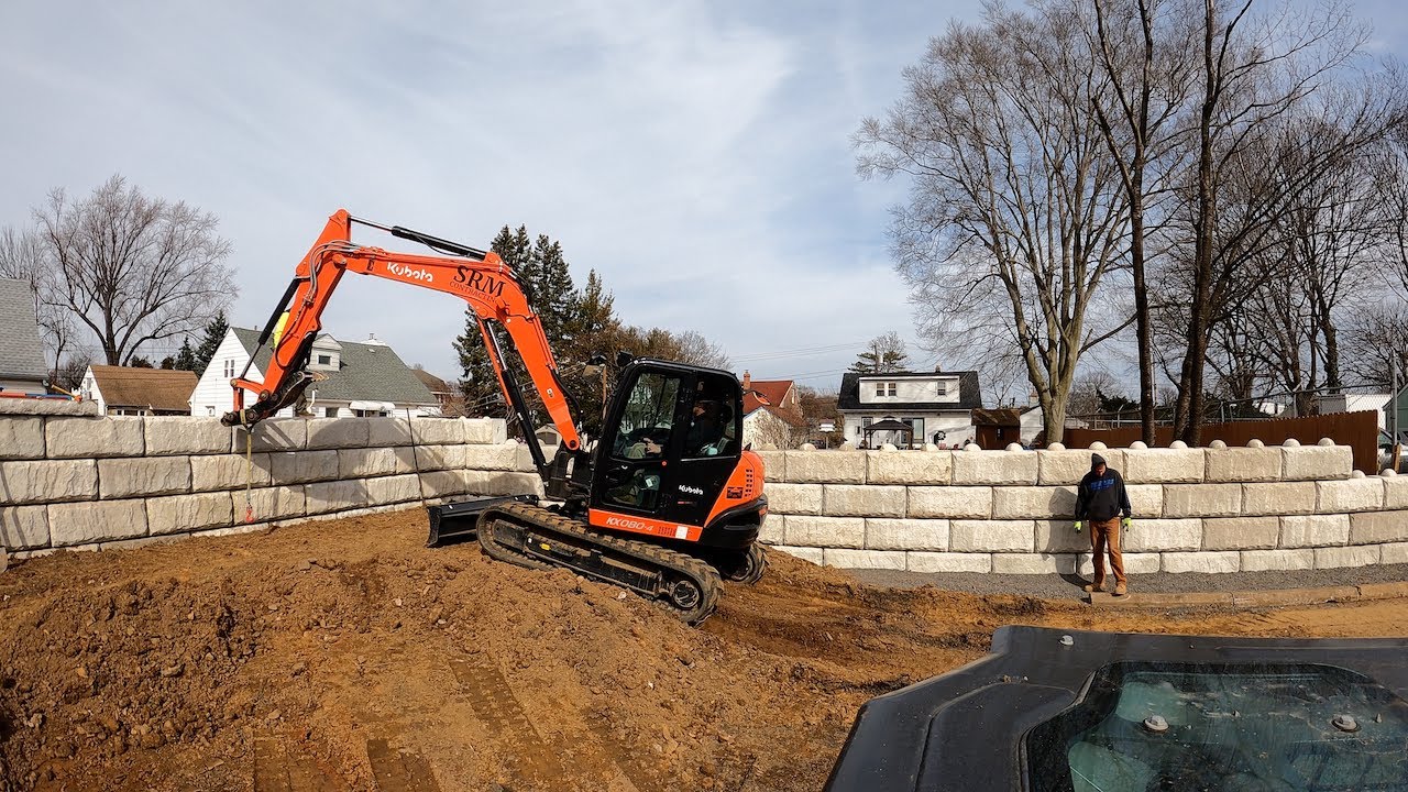 Freestanding Redi Rock retaining wall build - YouTube