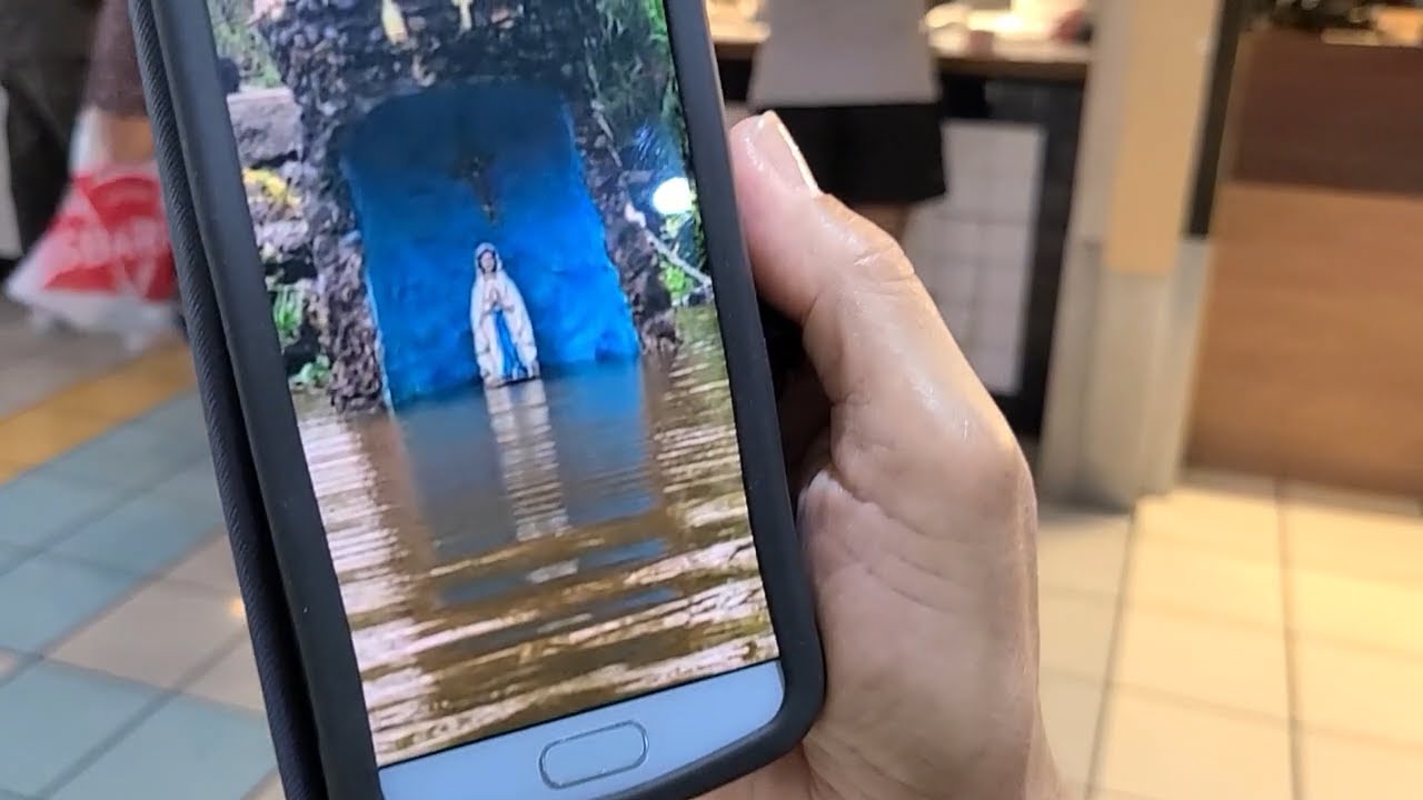 Chalan Pago woman's statue of Blessed Mary remains above water - YouTube