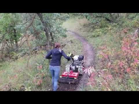 Harrow being used for trail critical edge restoration - YouTube