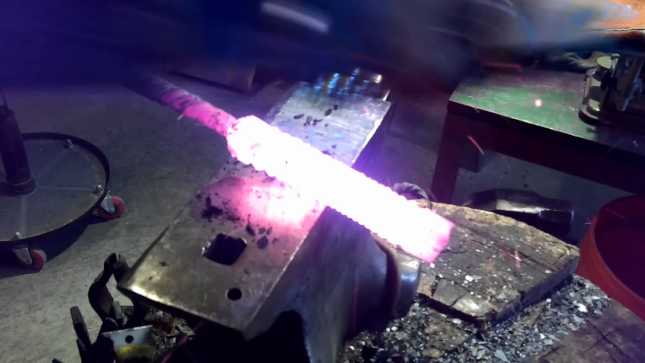 Forging a damascus knife part 1, drawing out and twisting our 12 layer ...