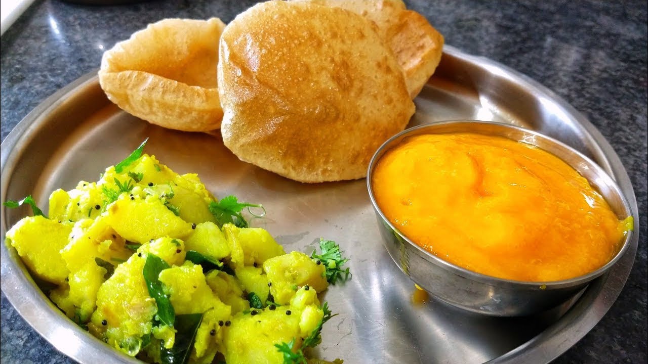 Tasty and simple refreshing mango juice and with Puri tasty and simple ...