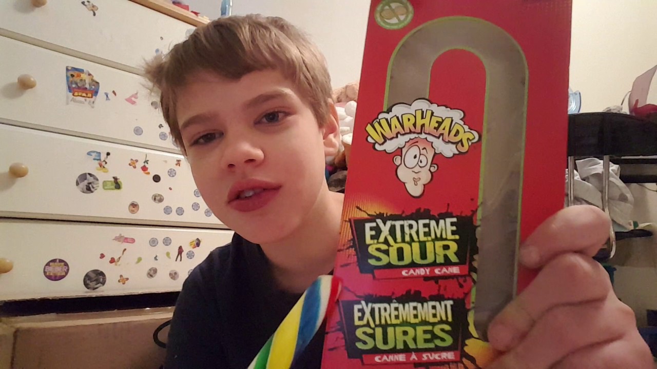 Trying the warheads extreme sour candy cane - YouTube