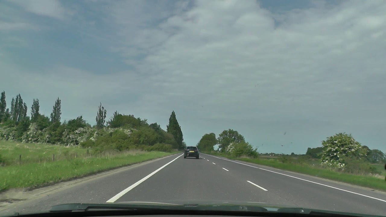 Driving into Lincolnshire on the A16 road into Boston on way to ...