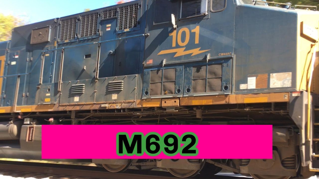 CSX M692 lead by a veteran bright future C40-8W - YouTube