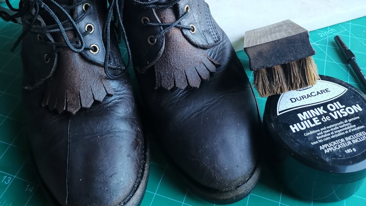 Waterproofing my work boots with mink oil - YouTube