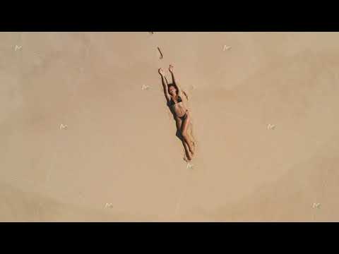 Aerial Drone View of Bikini Woman on Tropical Beach with Calm Waves
