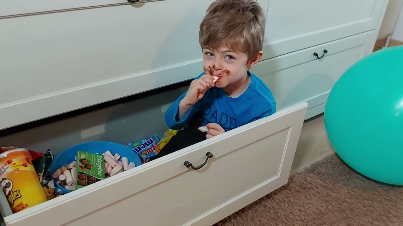 Little boy is hiding in cabinet eating sweets and candys - YouTube