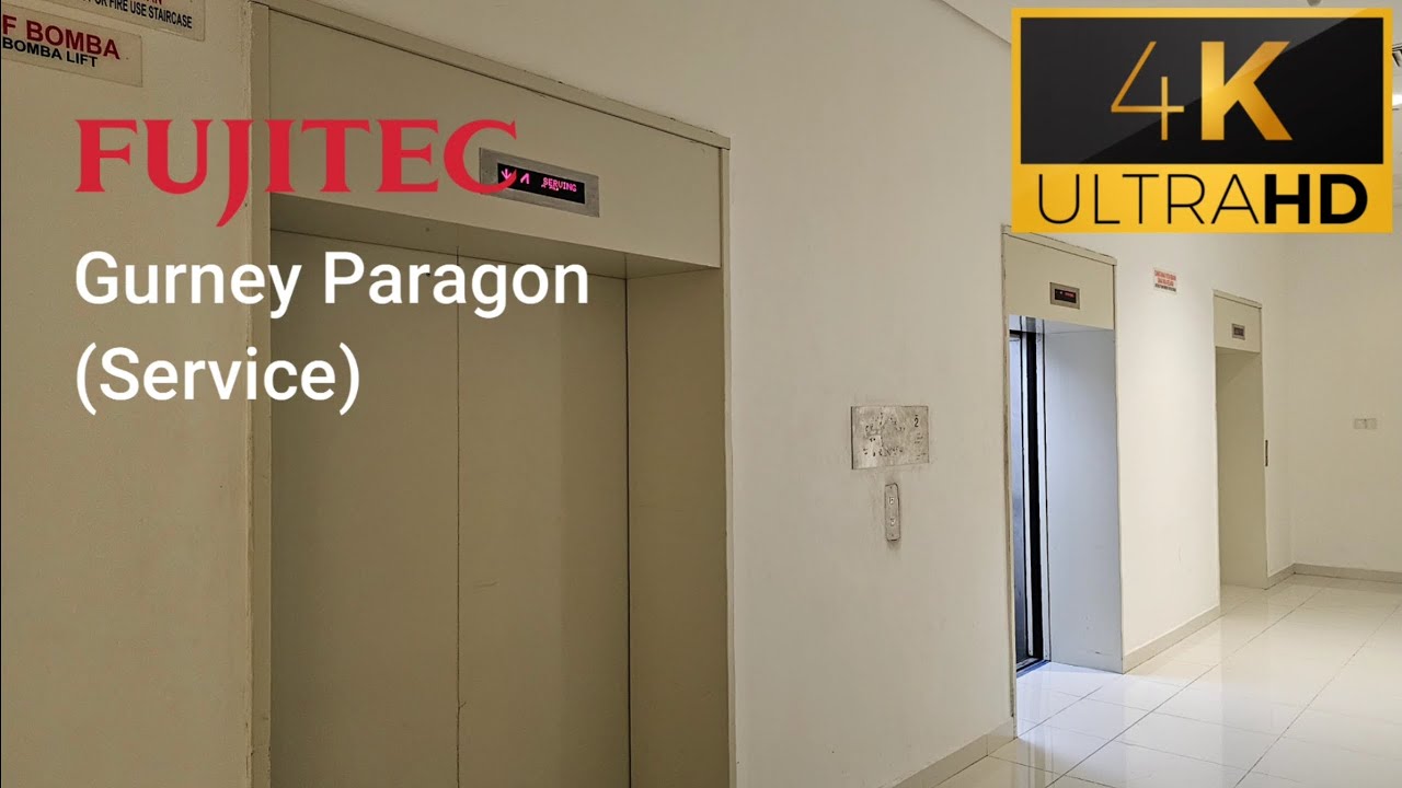 Fujitec service lifts at Gurney Paragon - YouTube