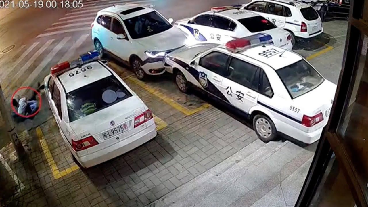 Heroic Chinese policeman pushes pedestrians out of way of oncoming car ...