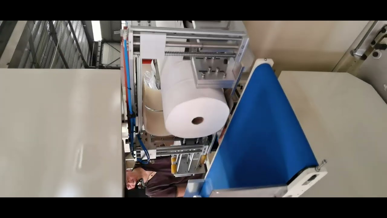 Automatic maxi roll cutting machine - YouTube