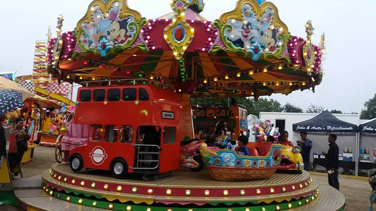 Jas enjoying the fun fair ride at Burgess park London - YouTube