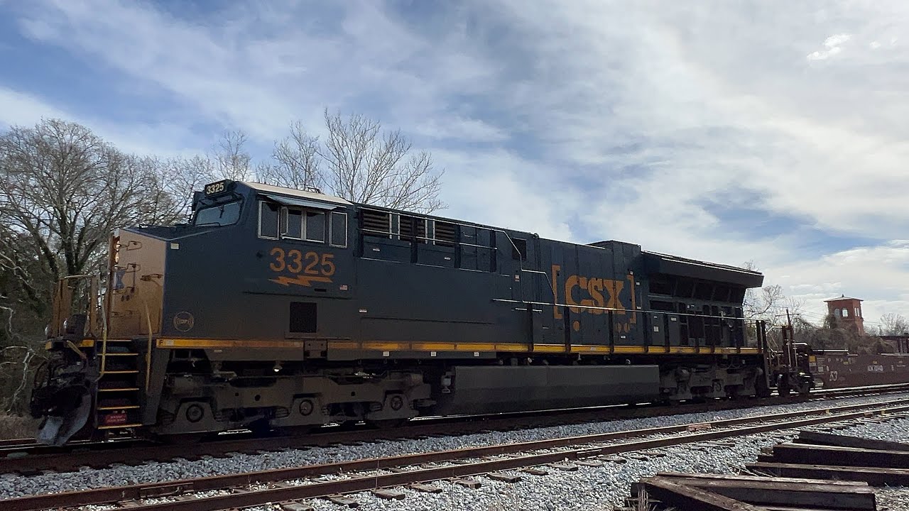 CSX 3325 & Mid DPU CSX 3395 moving a massive shipping container train ...
