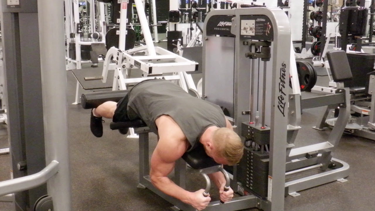 Machine Laying Hamstring Curl - YouTube