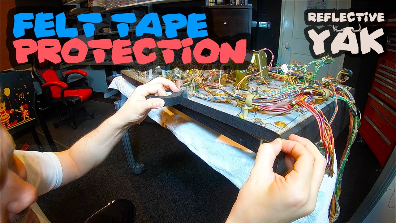 Applying felt tape to the edges of a pinball playfield - YouTube