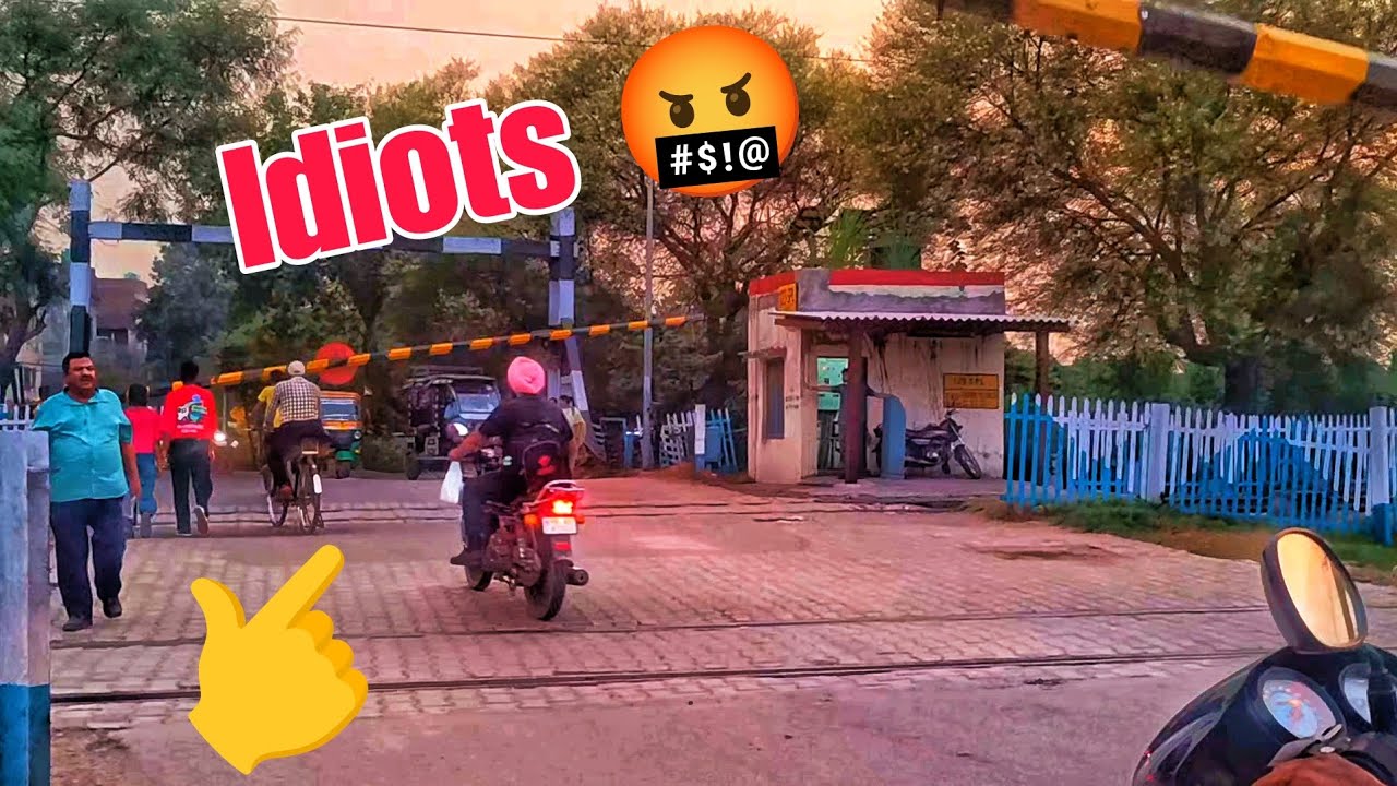 😡Idiot people risks their life trying to cross railway track with gates ...