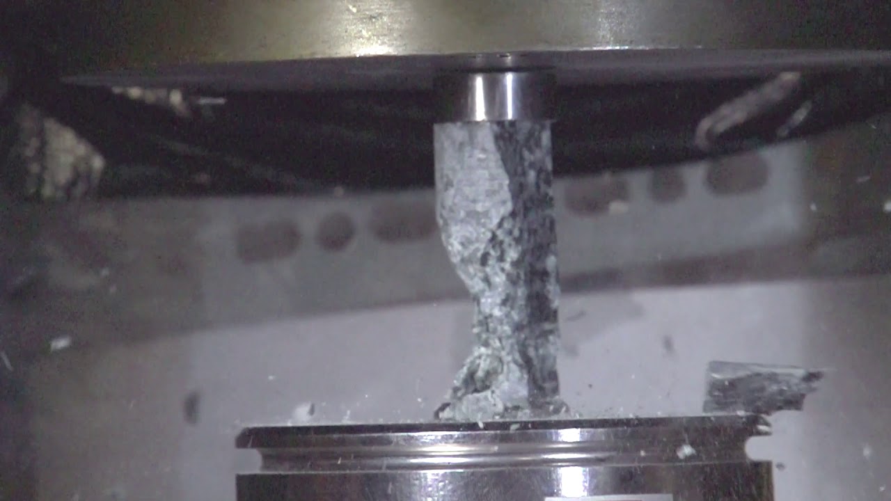 A dolerite sample being crushed - YouTube
