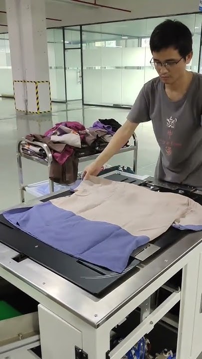 Automatic clothing shirt folding machine - YouTube