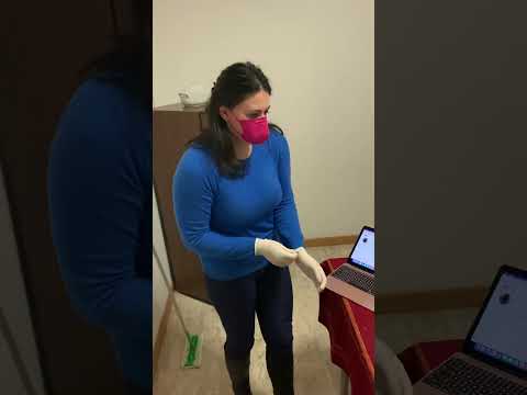 Cleaning the kitchen in tight latex gloves and leather boots