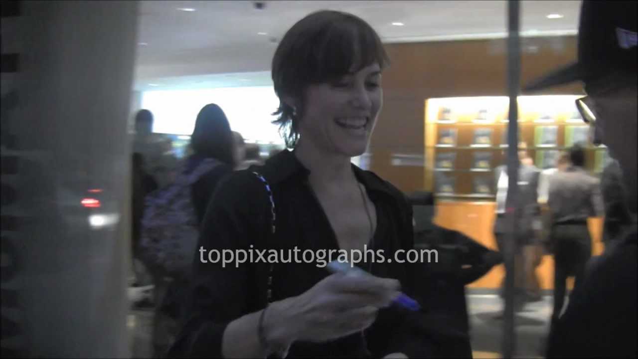 Carey Lowell - Signing Autographs at "The Untold Story Of 007" in NYC ...