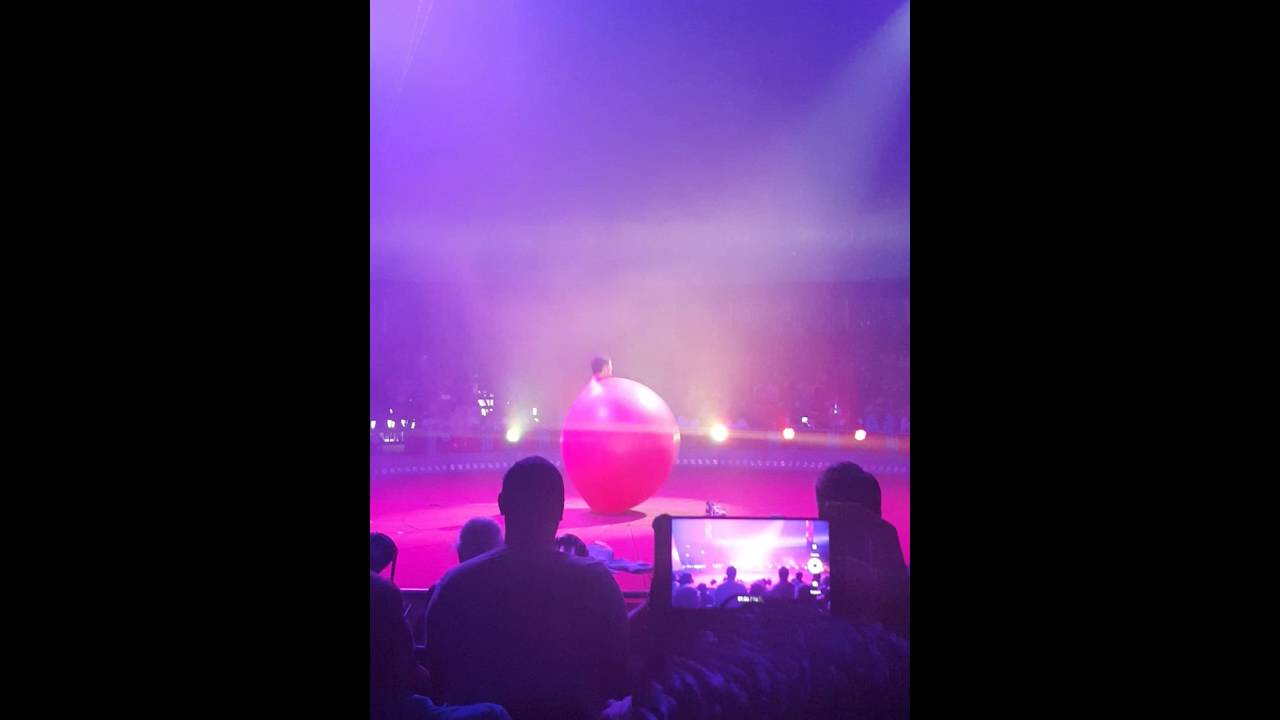 Human balloon act - YouTube