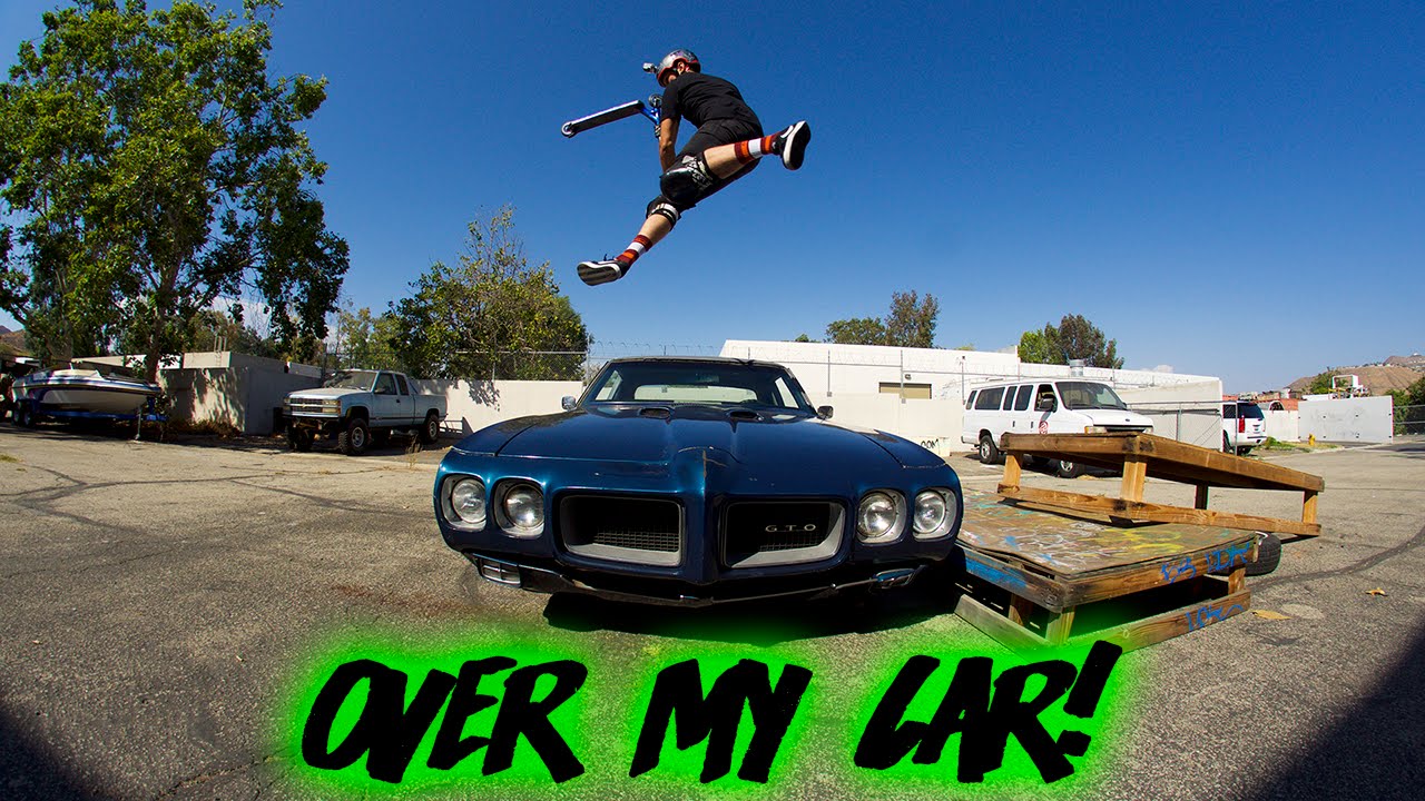 SCOOTER RIDER JUMPS OVER CAR! - YouTube