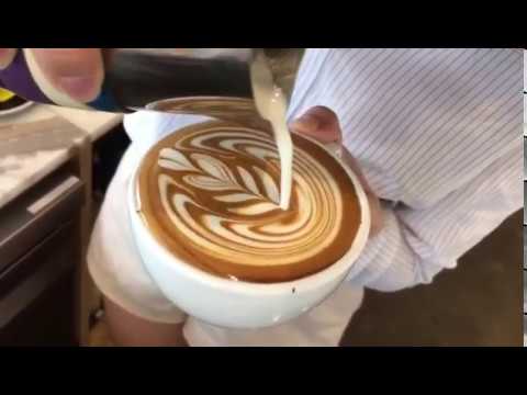 Coco the barista pouring her signature 'Slow-Base Tulip'