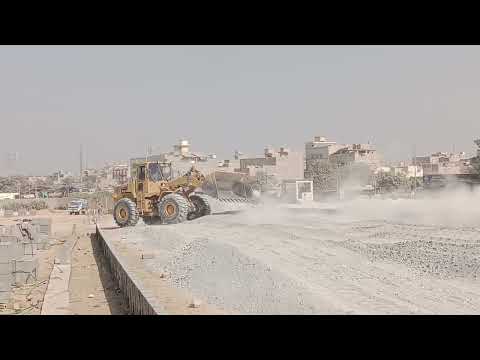 caterpillar loader lying aggregate base course - YouTube