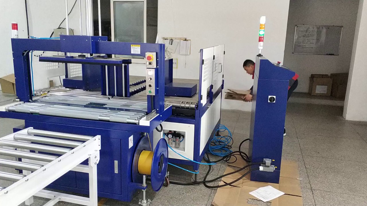 Corrugated carton box strapping machine with 5mm straps - YouTube