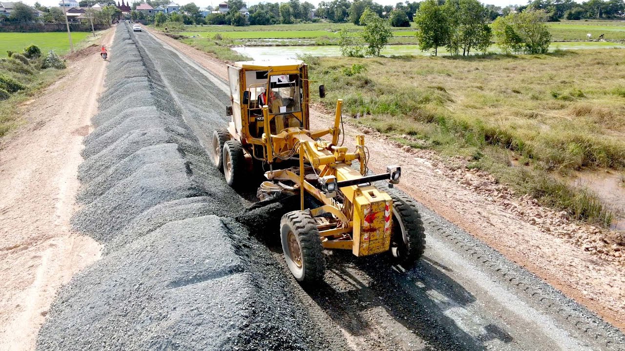 Wonderful Of Motor Grader In Actoin Spreading Black Gravel Build Road ...