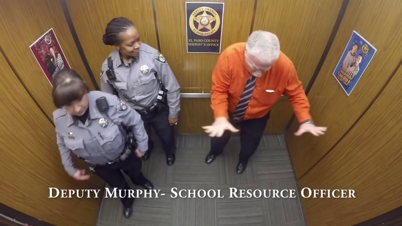 Police officers dance in elevator - YouTube